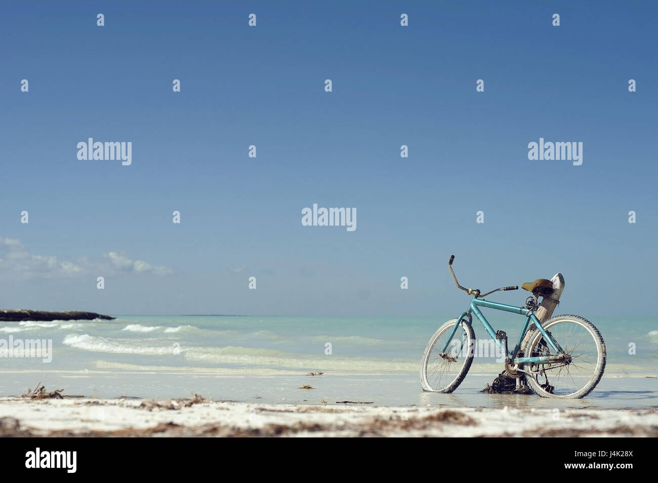 Blue bike ona beach Stock Photo - Alamy