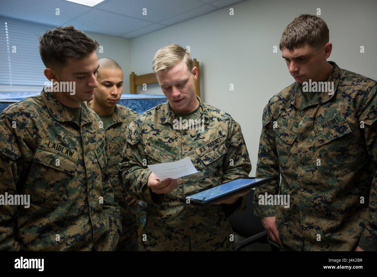 U.S. Marine Corps Sgt. Landon G. McCabe, center, a squad leader with ...