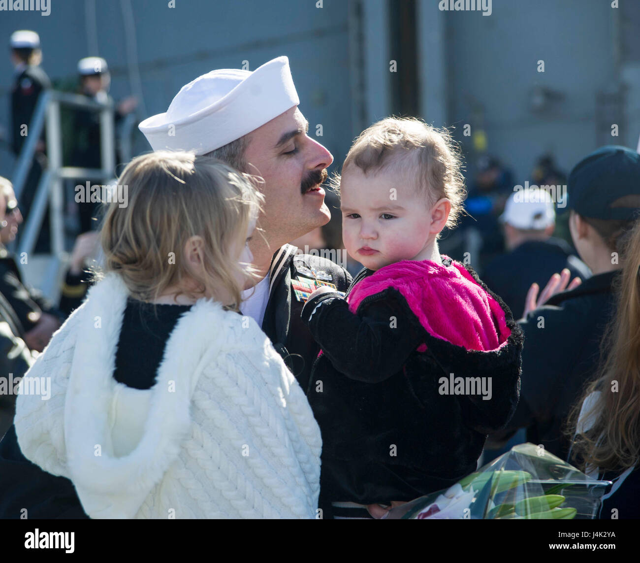 170119-N-NI420-150 NORFOLK (Jan. 19, 2017) A Sailor greets his family ...