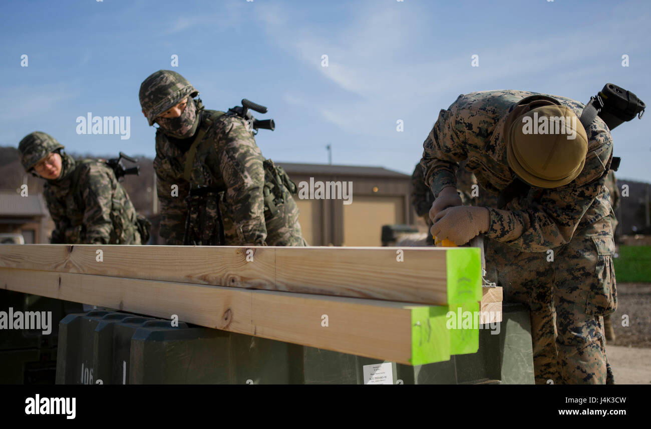 U.S. Marines, with Alpha Company, 9th Engineer Support Battalion, 3rd ...