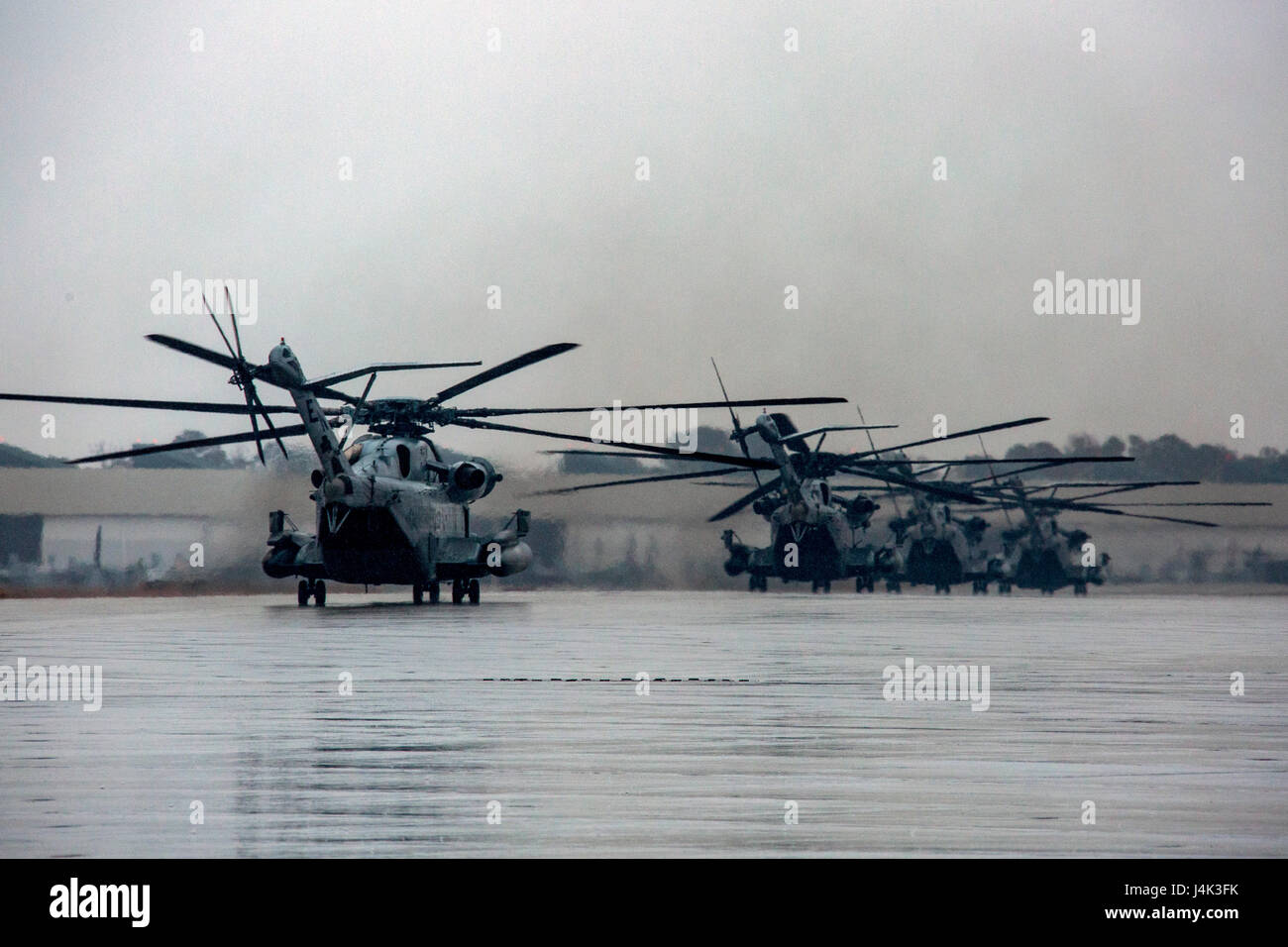 U.S. Marines with Marine Heavy Helicopter Squadron 464 taxi CH-53E ...