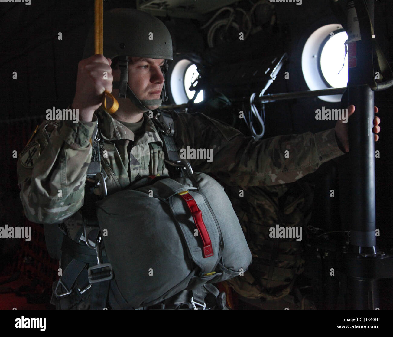 U.S. Army paratrooper of the 310th Psychological Operations Company ...