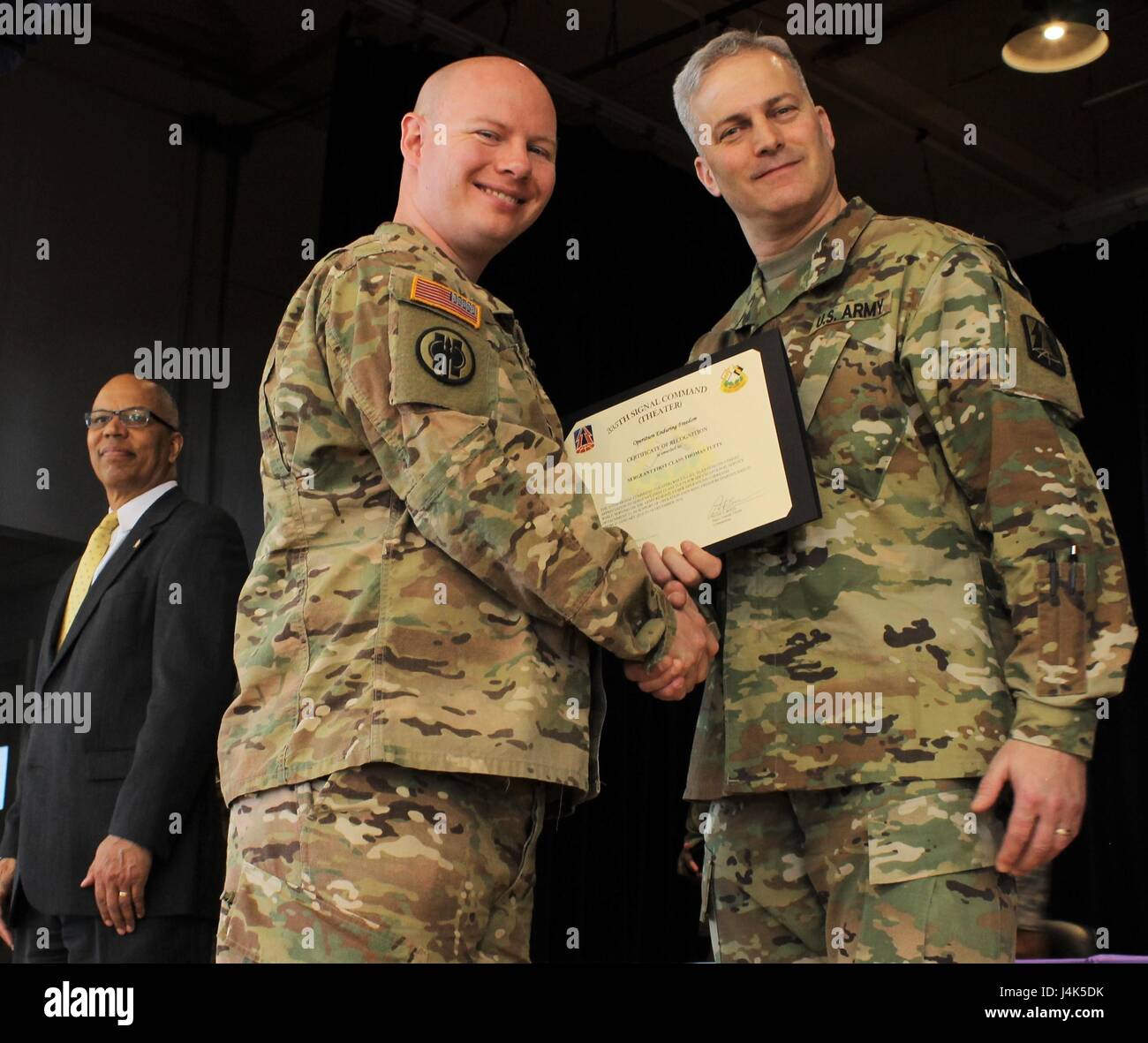 U.S. Army Sgt. 1st Class Thomas Tufts (left), an Army Reserve Soldier ...