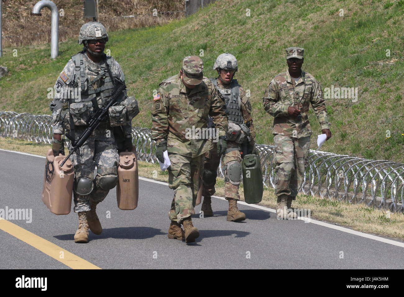 Participants for 2nd Infantry Division Best Warrior competition carry ...