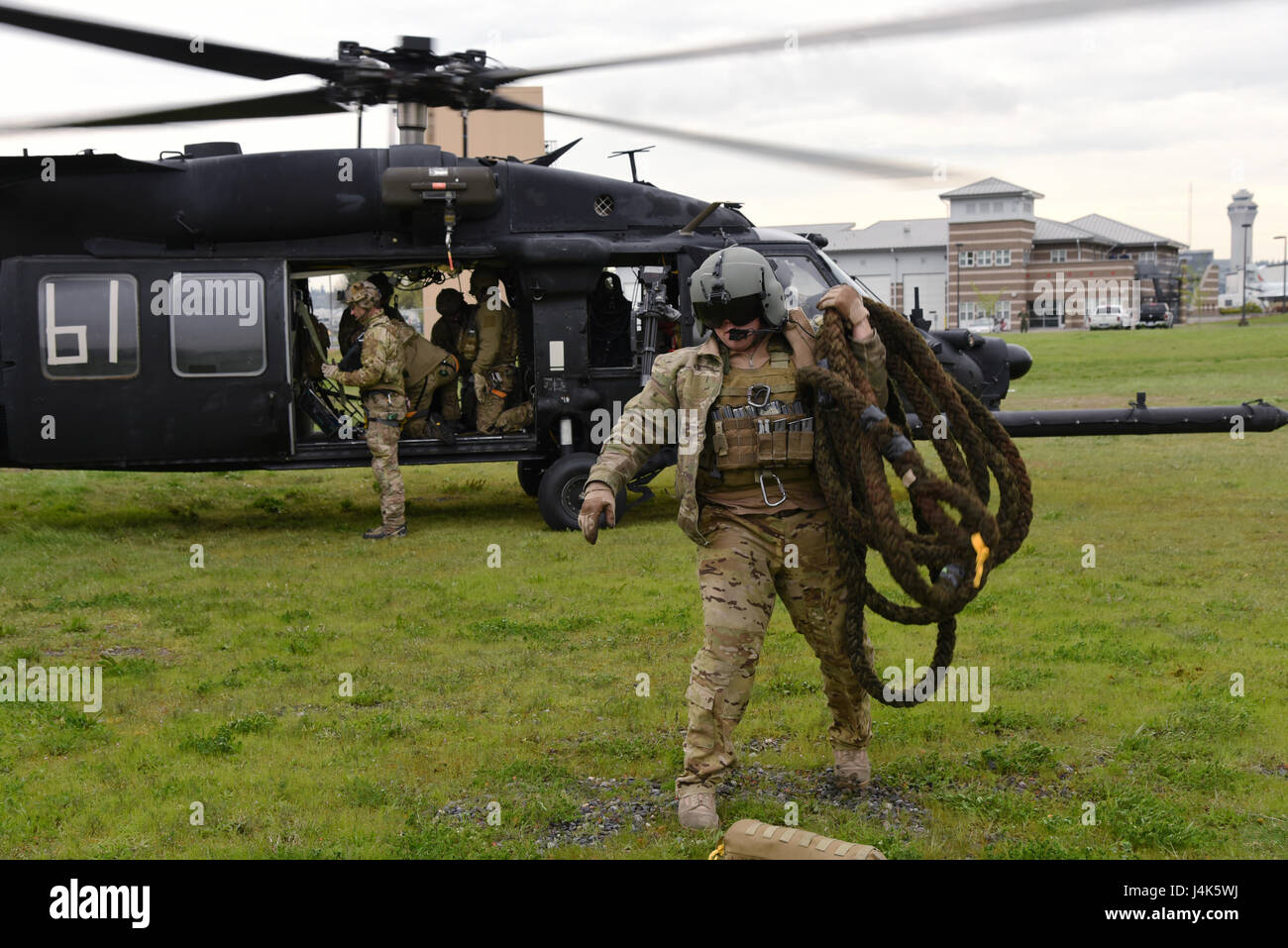 A crew member from the C/4-160th SOAR (Night Stalkers) collects a ...