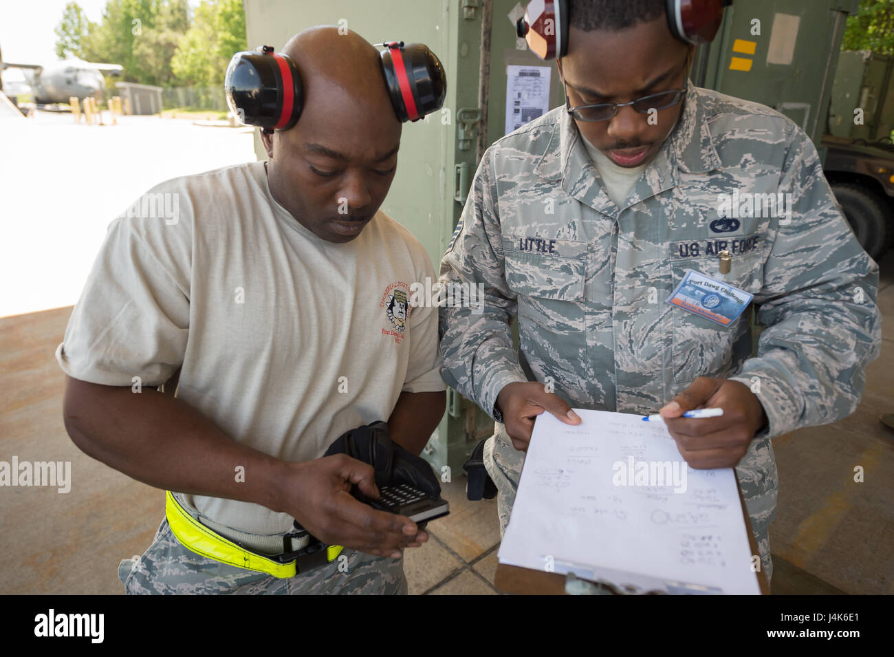 U.S. Air Force Tech. Sgts. Eric Harmon and Alfred Little review cargo ...