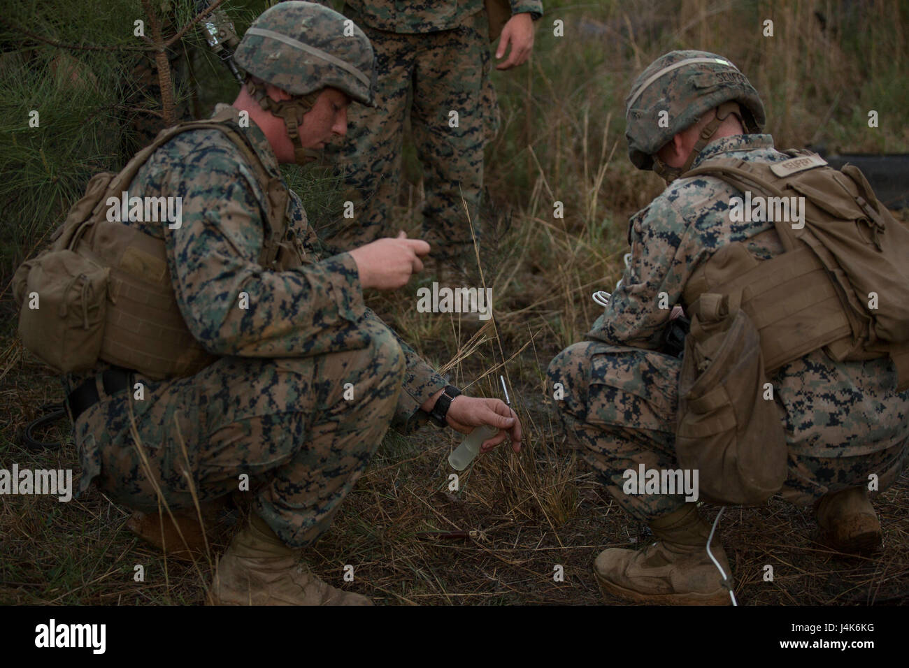 Marines prime an explosive charge during a demolitions range at Fort A ...