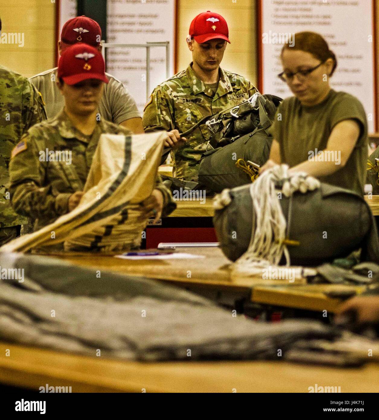 Parachute Riggers wear the Red Hat signifying that they are experts ...