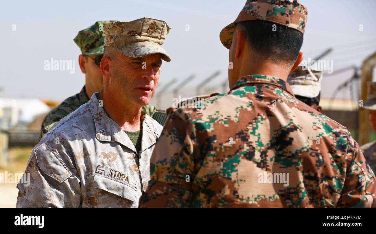 U.S. and Jordanian military personnel gather together for a meet and ...