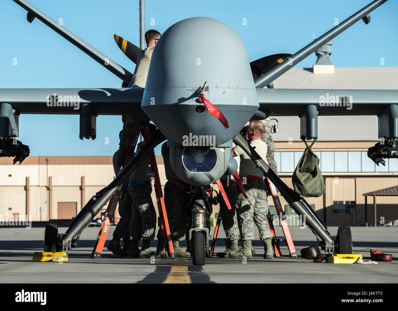 49th Aircraft Maintenance squadron Airmen attach an engine cover panel ...