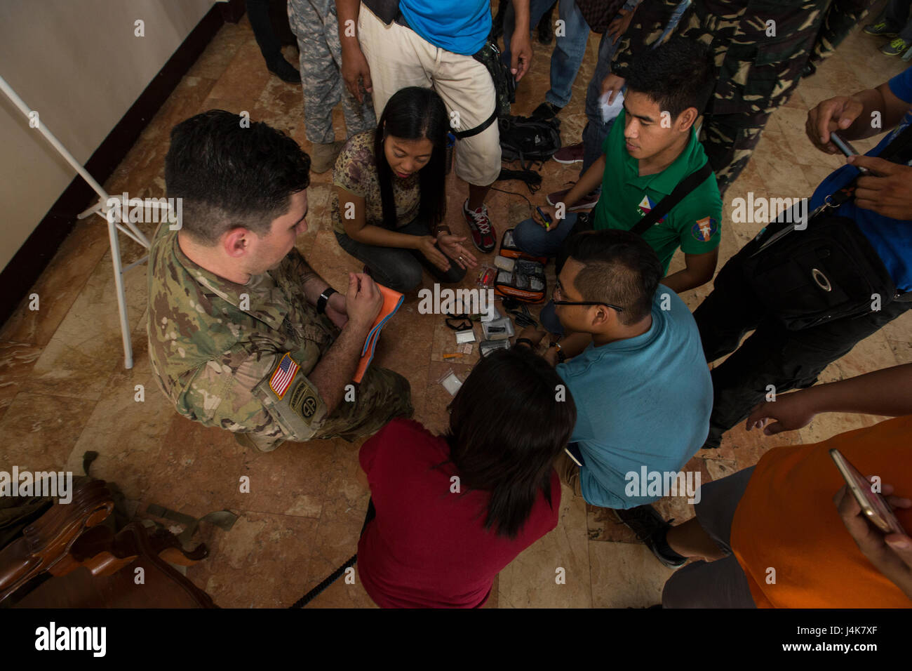 U.S. Army Staff Sgt. Jordan Curtis demonstrates an emergency splint to ...