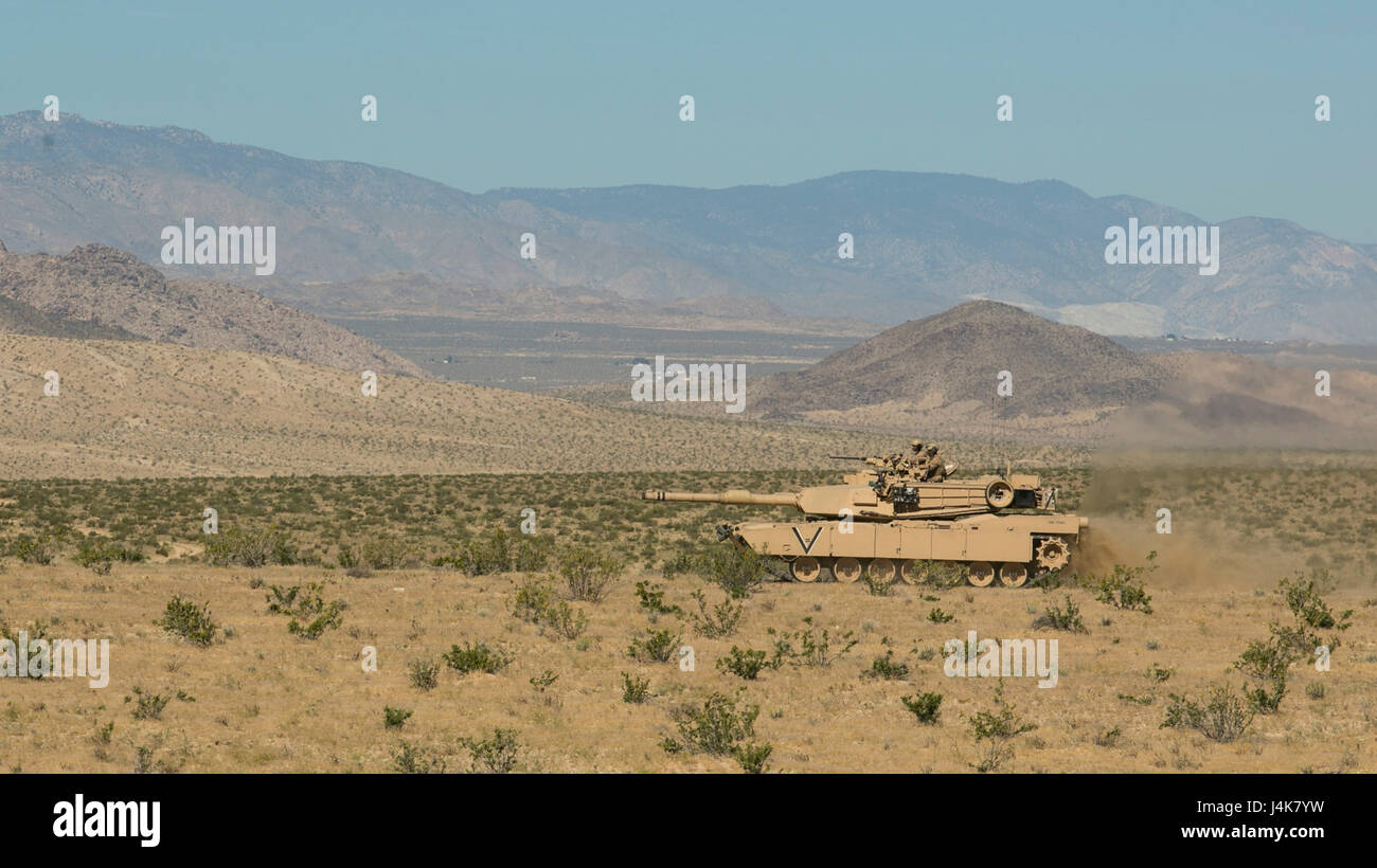 Marines with 1st Tank Battalion traverse terrain in an M1A1 Abrams Main ...