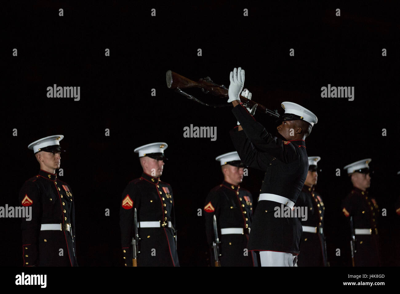 The Marine Corps Silent Drill Platoon performs during an evening parade ...