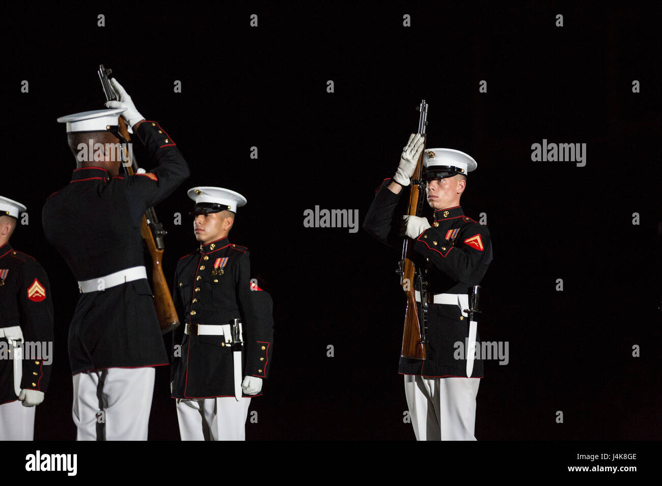 The Marine Corps Silent Drill Platoon performs during an evening parade ...