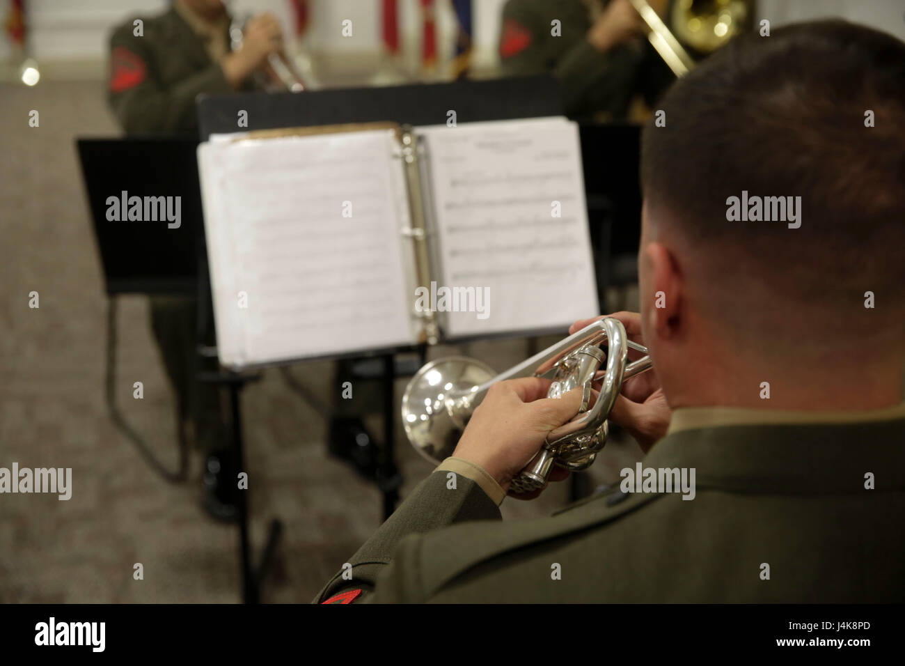 A Marine band member plays the trumpet during the Purple Star Memorial ...
