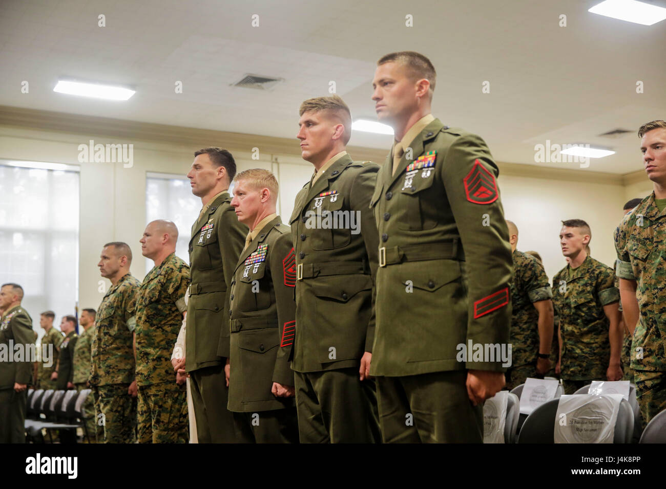 Marines with 2nd battalion, 8th Marine regiment, 2nd Marine Division stand in attention as taps ...