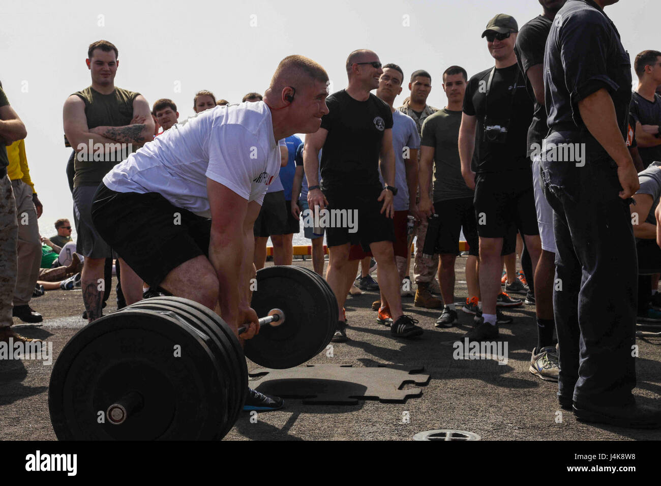 A power lifting competition takes place on the flight deck of the ...