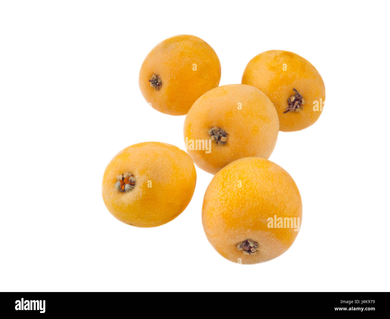 Five loquat fruits isolated on white Stock Photo - Alamy