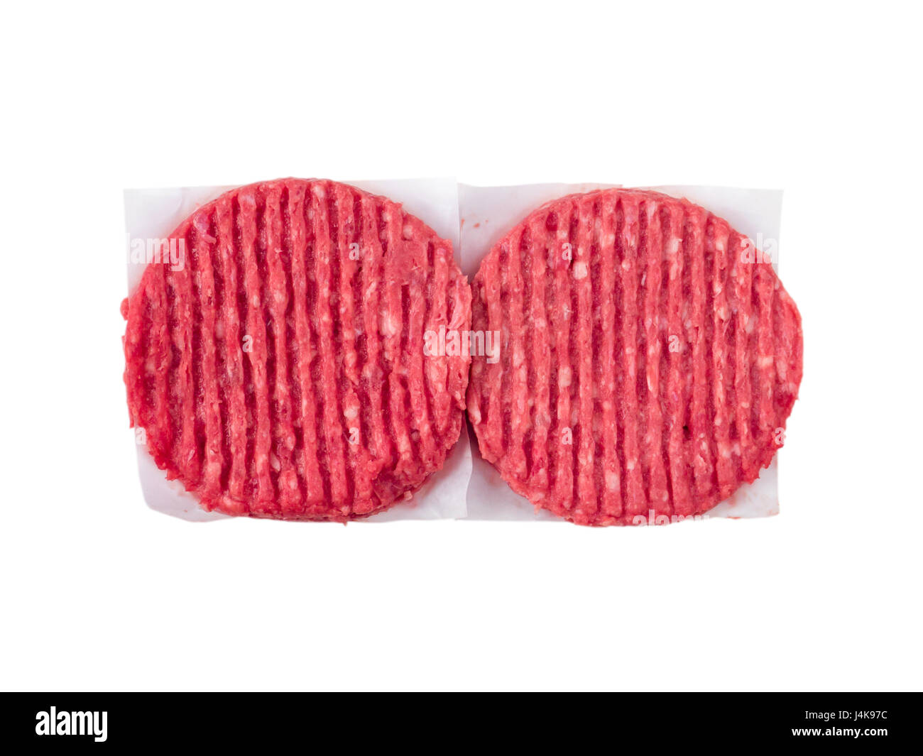 Two mixed pork and beef burgers on the paper sheets isolated on white ...