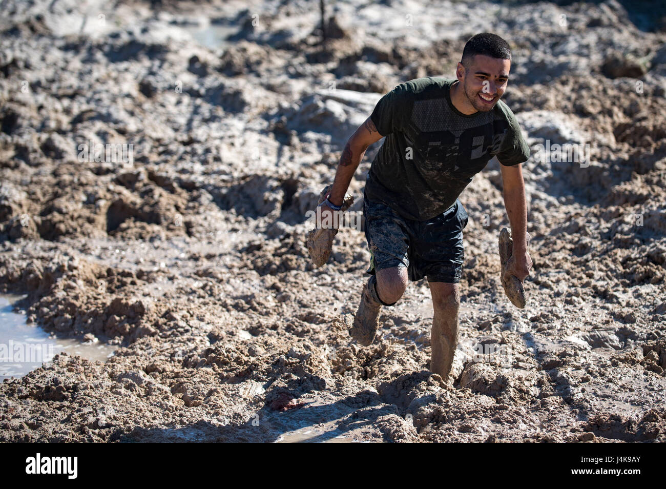 Participants complete obstacles during the annual Moody Mud Run in Ray ...