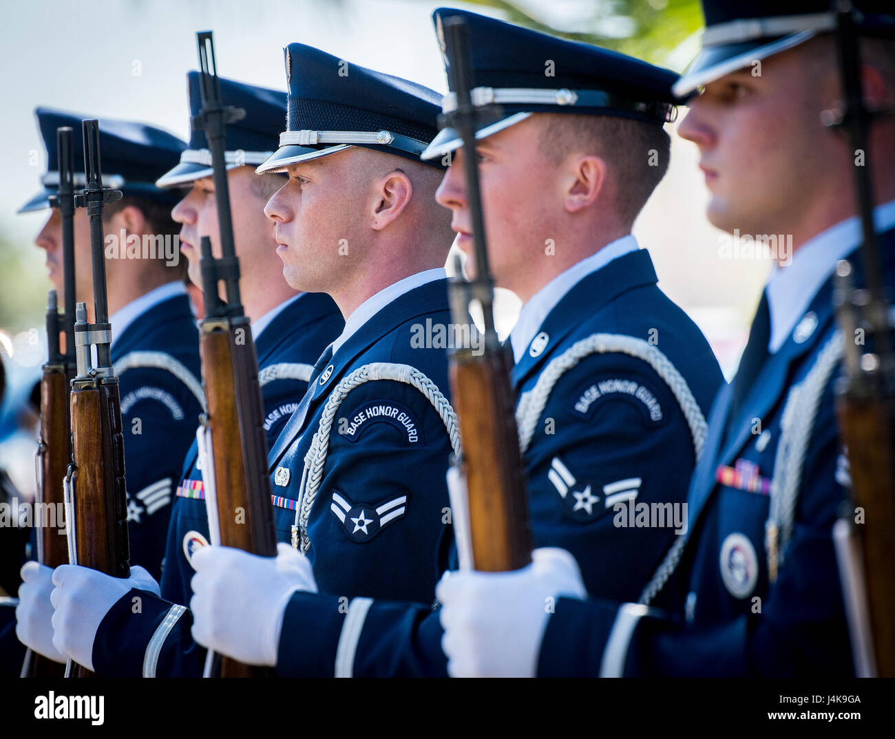 Honor Guard rifle team stand in position after a rifle volley to close ...