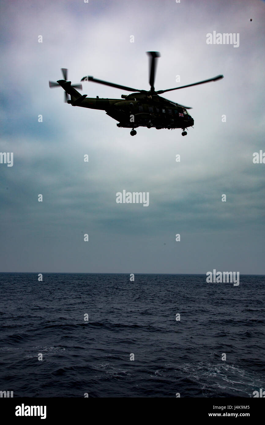 A British MK3 Merlin Helicopter conducts flight operations over the ...