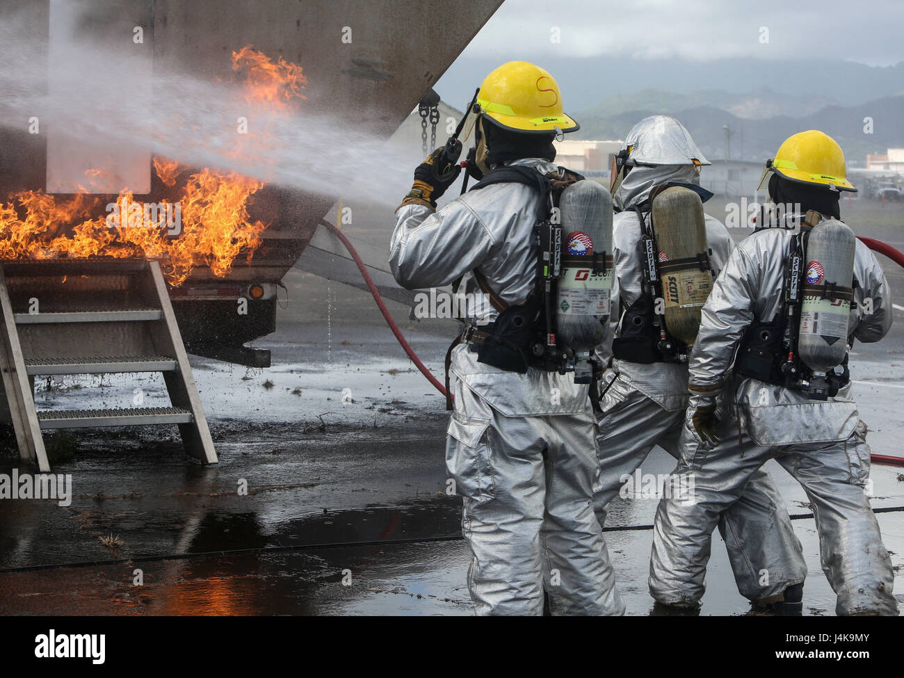 Marines with Aircraft Rescue and Firefighting extinguish a fire during ...