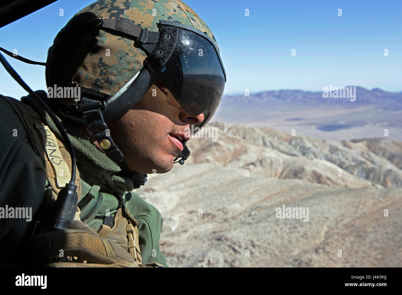Cpl. Carlton R. Evans, a UH-1Y Huey crew chief with Marine Light Attack ...