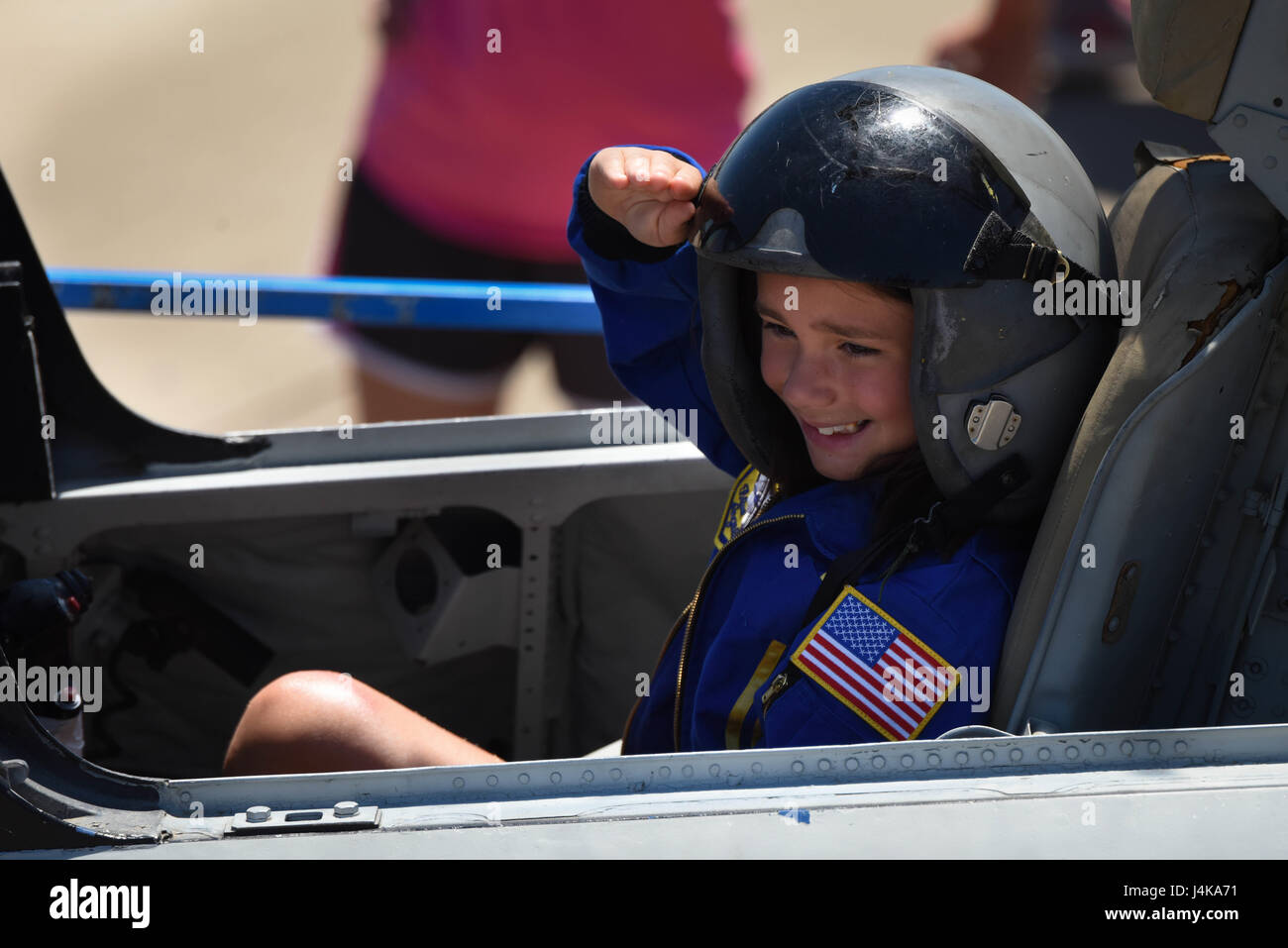 A child poses in the cockpit of a static aircraft display during the ...