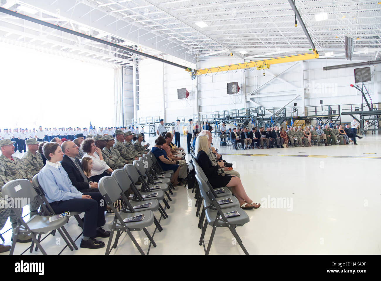 Attendees listen to Maj. Gen. John P. Stokes, 22nd Air Force commander ...