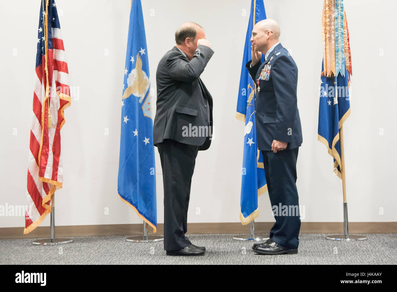 Col. Michael Manion, former 403rd Wing commander, salutes Col. Tommy ...