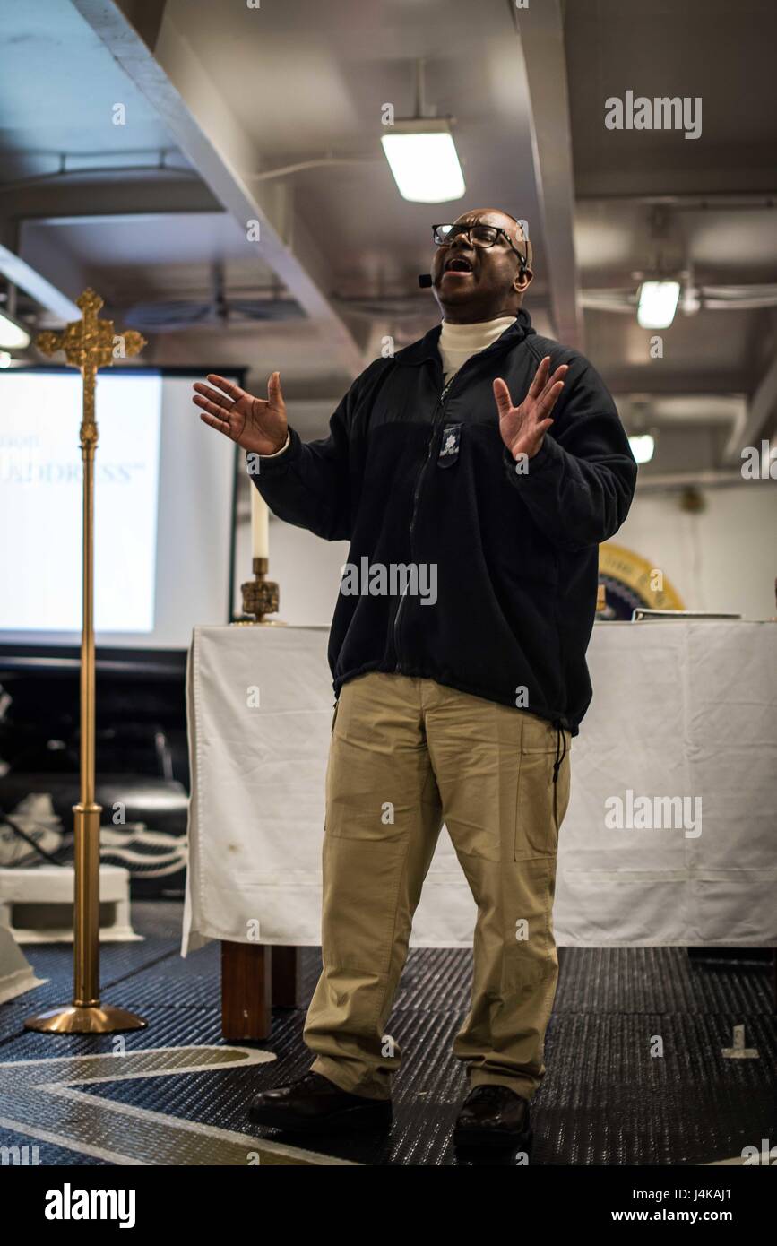 A Navy Chaplain delivers a farewell address aboard USS Theodore ...