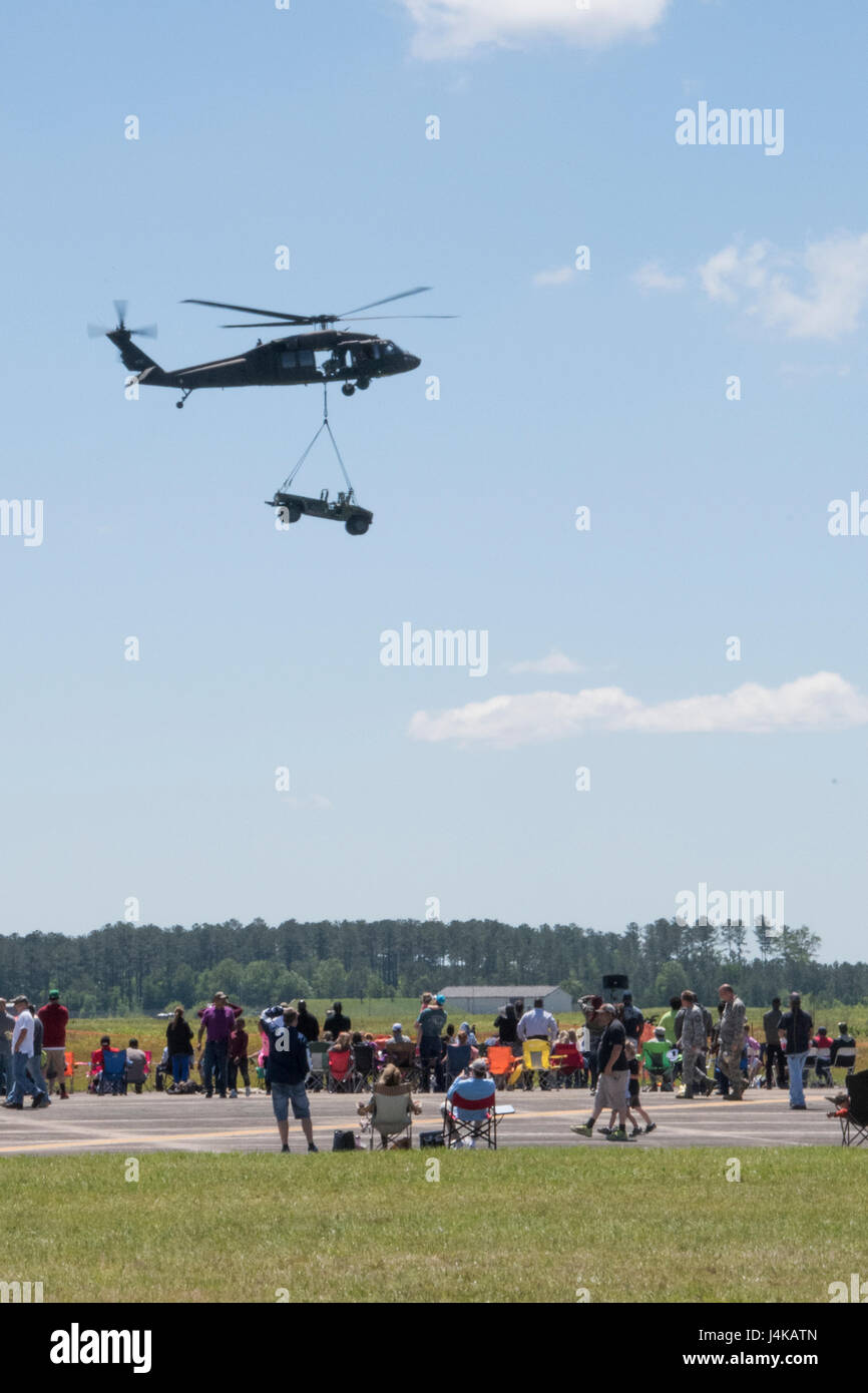 Crowds watch Soldiers from the Alpha Company, 2-149th General Support ...