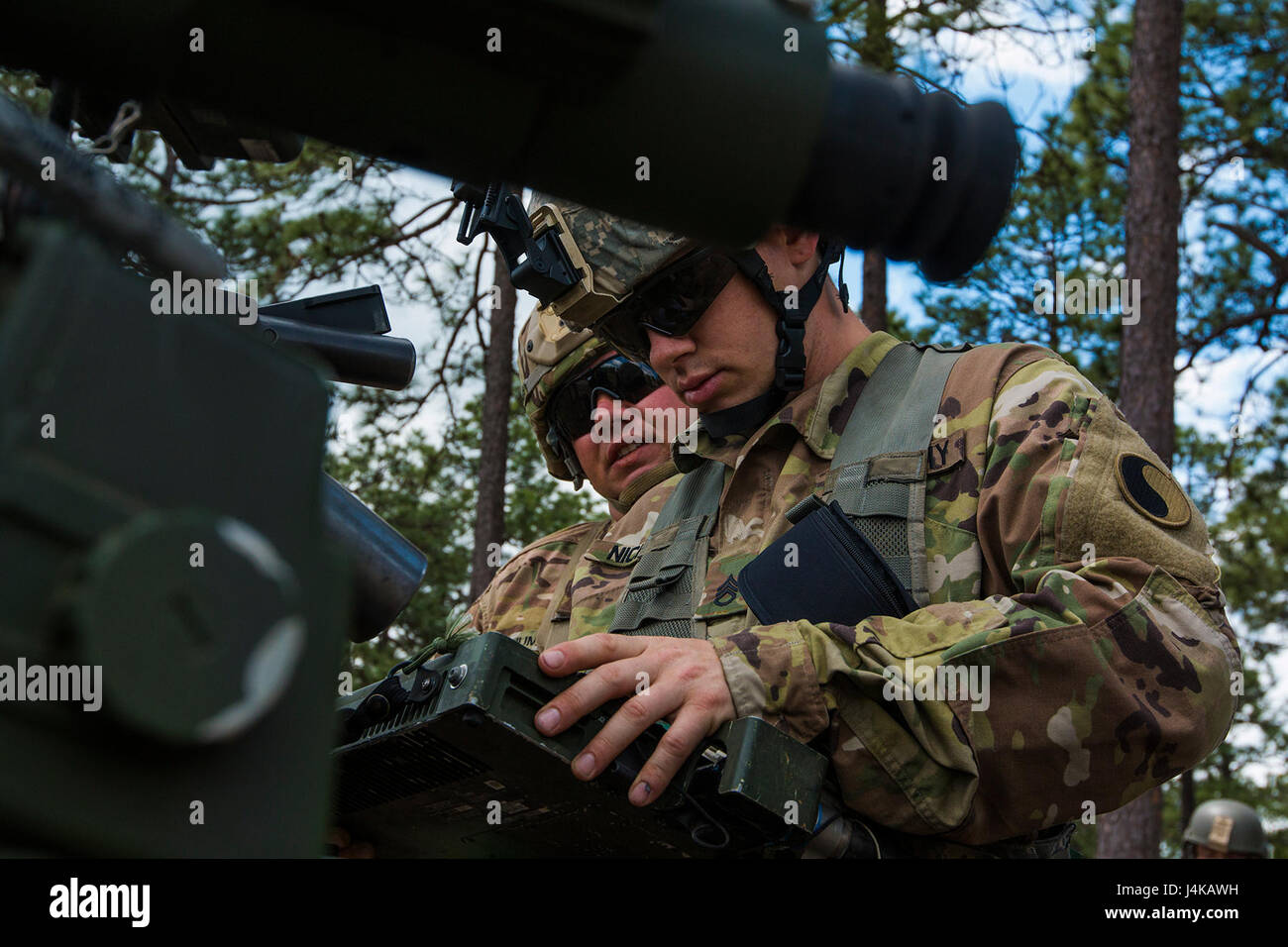 Staff Sgt. Christopher Humphrey (left), a howitzer section chief with ...