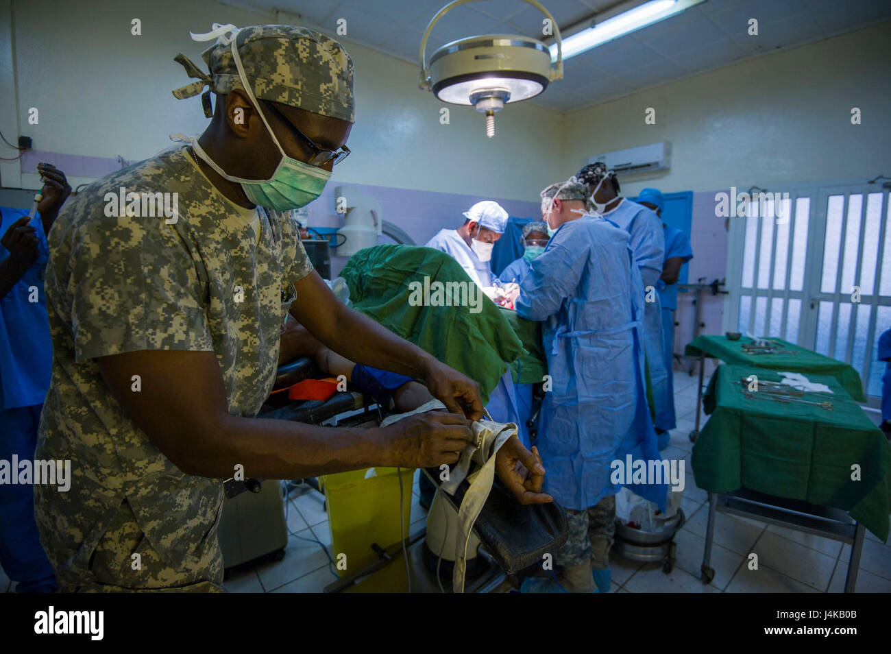 U.S. Army Reserve Maj. Christopher Sims, a nurse anesthetist, assigned ...