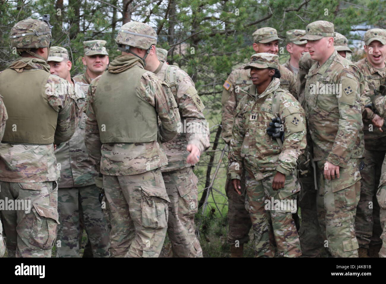 A tank platoon from 1st Battalion, 66th Armor Regiment, is cheered on ...