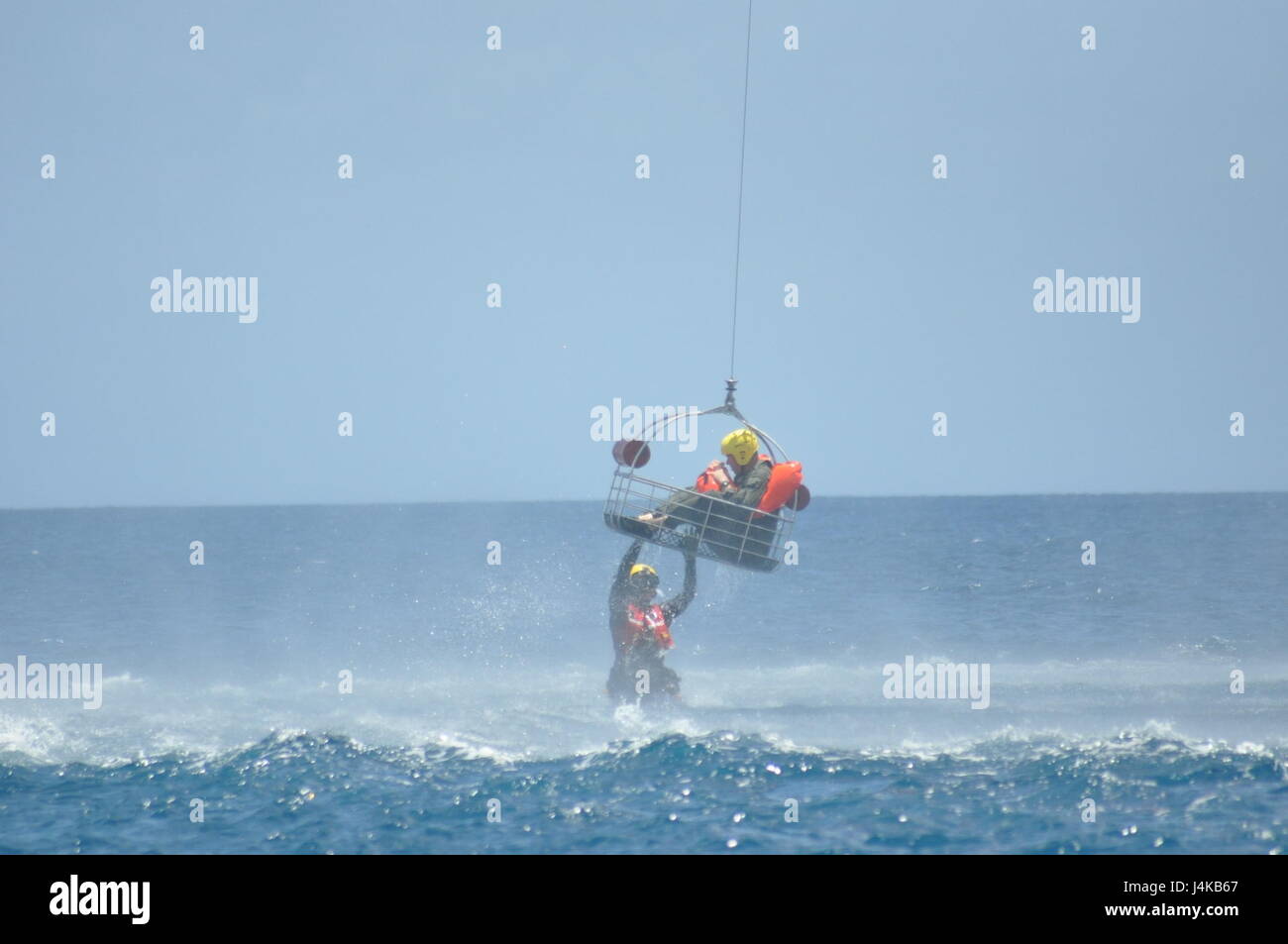 The U.S. Coast Guard diver "rescues" a member of the 53rd Weather ...