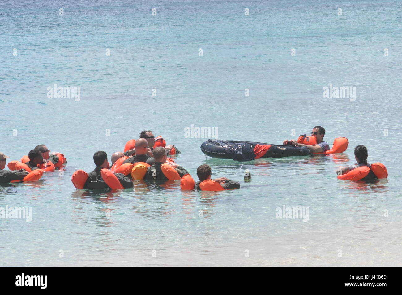 Members of the 53rd Weather Reconnaissance Squadron review how to use ...