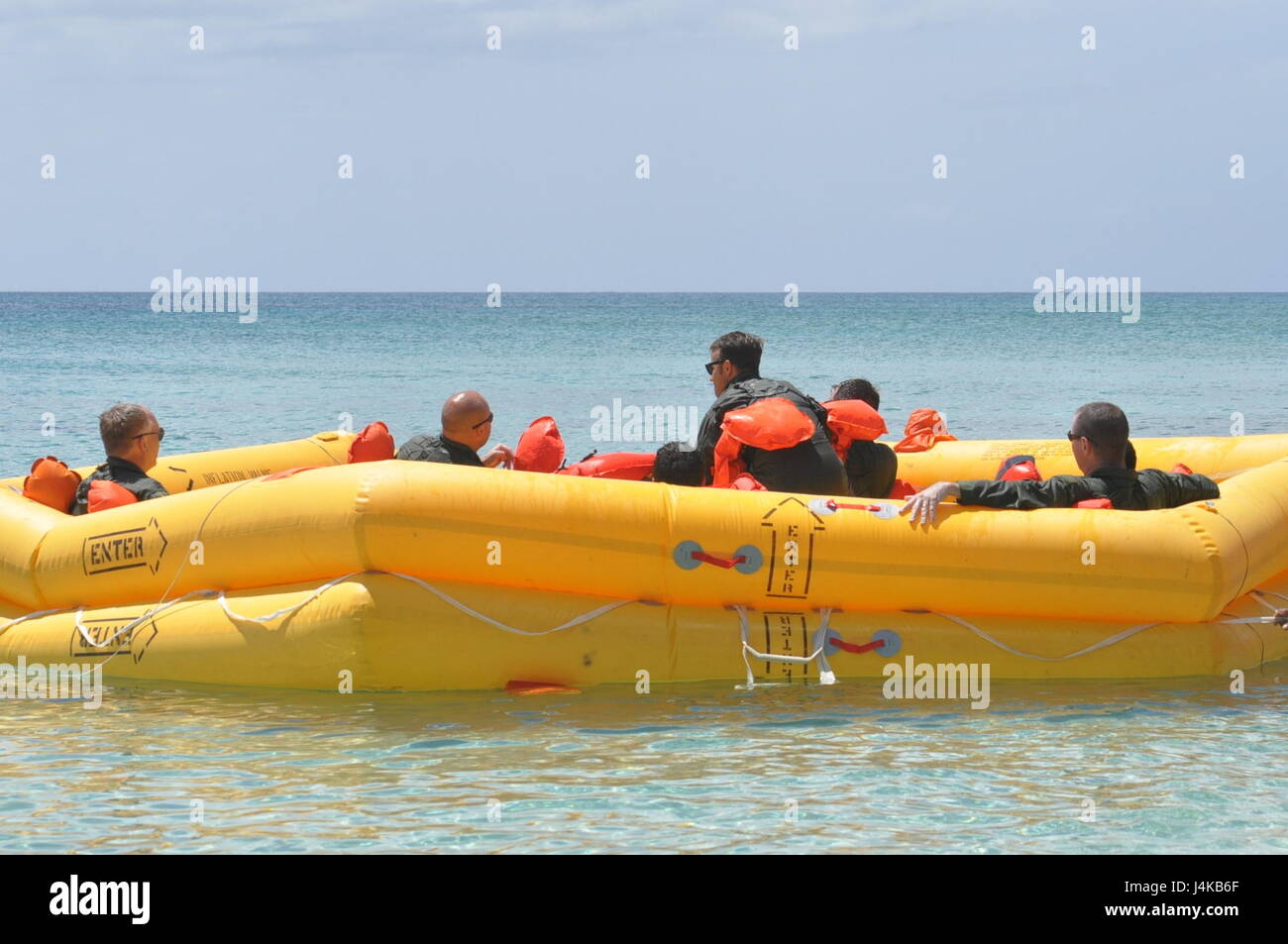 Personnel from the 53rd Weather Reconnaissance Squadron conduct water ...