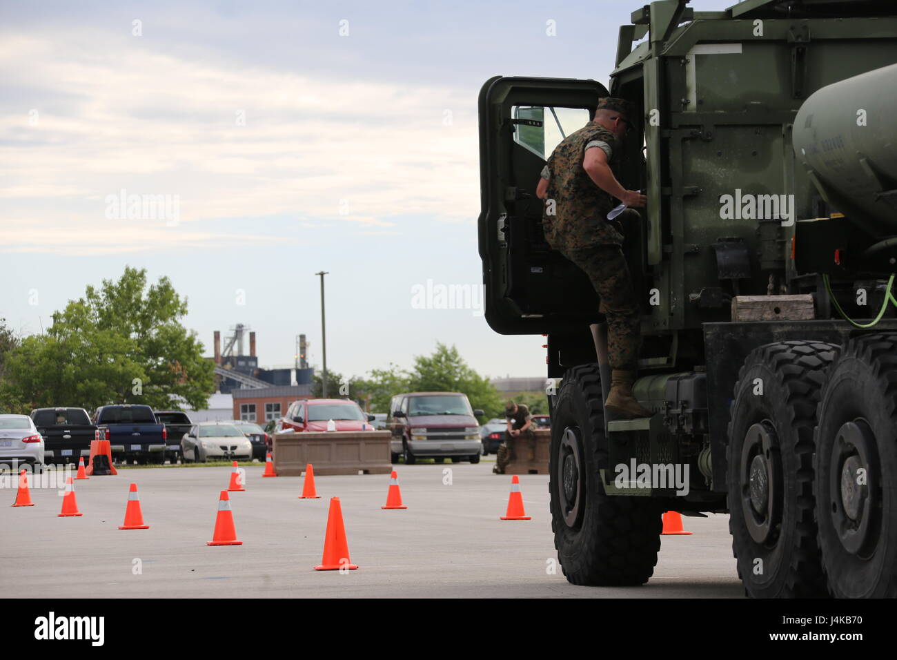Pfc. Logan Harpine enters the cab of a M970 semitrailer refueler truck ...