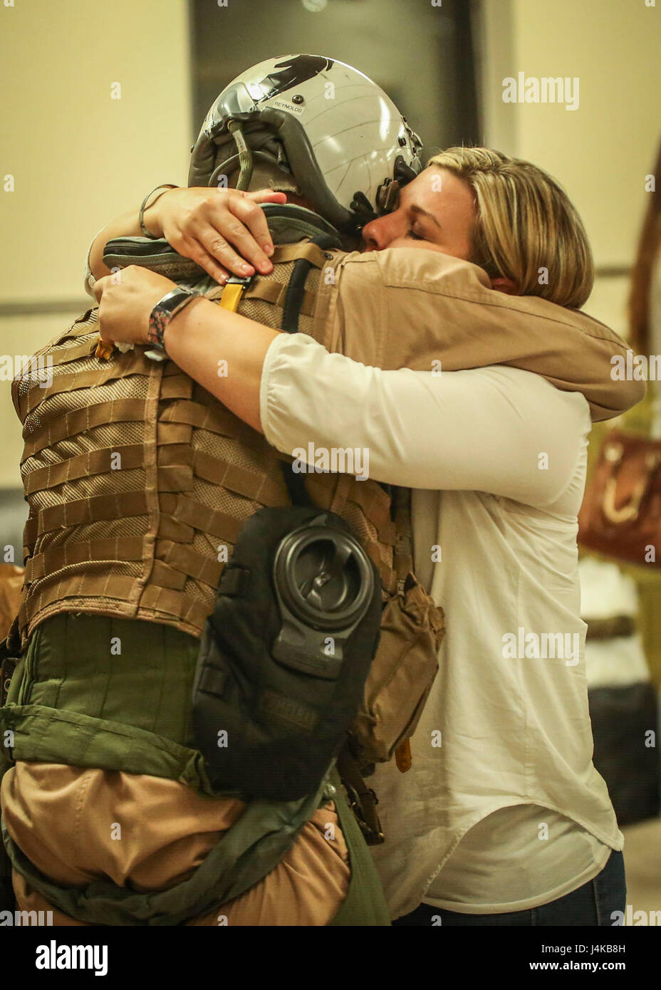 A pilot says goodbye to his family before departing for a deployment ...