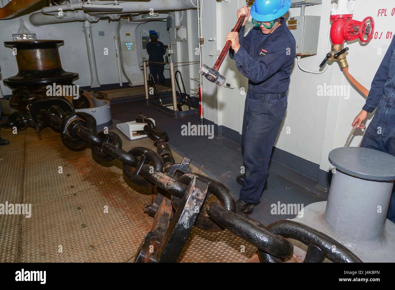 A Boatswain’s Mate performs a precision anchor drop test using a ...