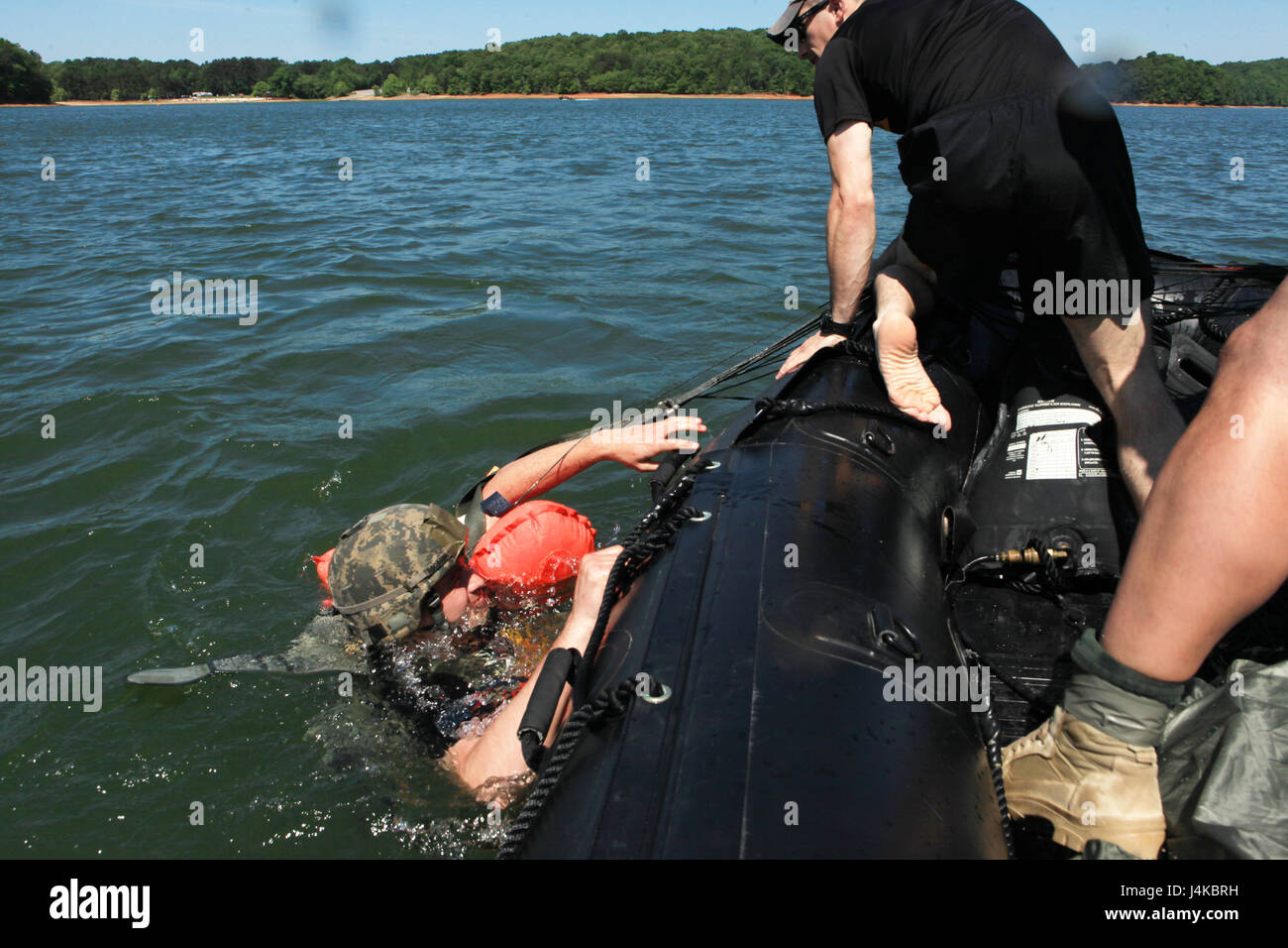 A Ranger Instructor from 5th Ranger Training Battalion assists a ...