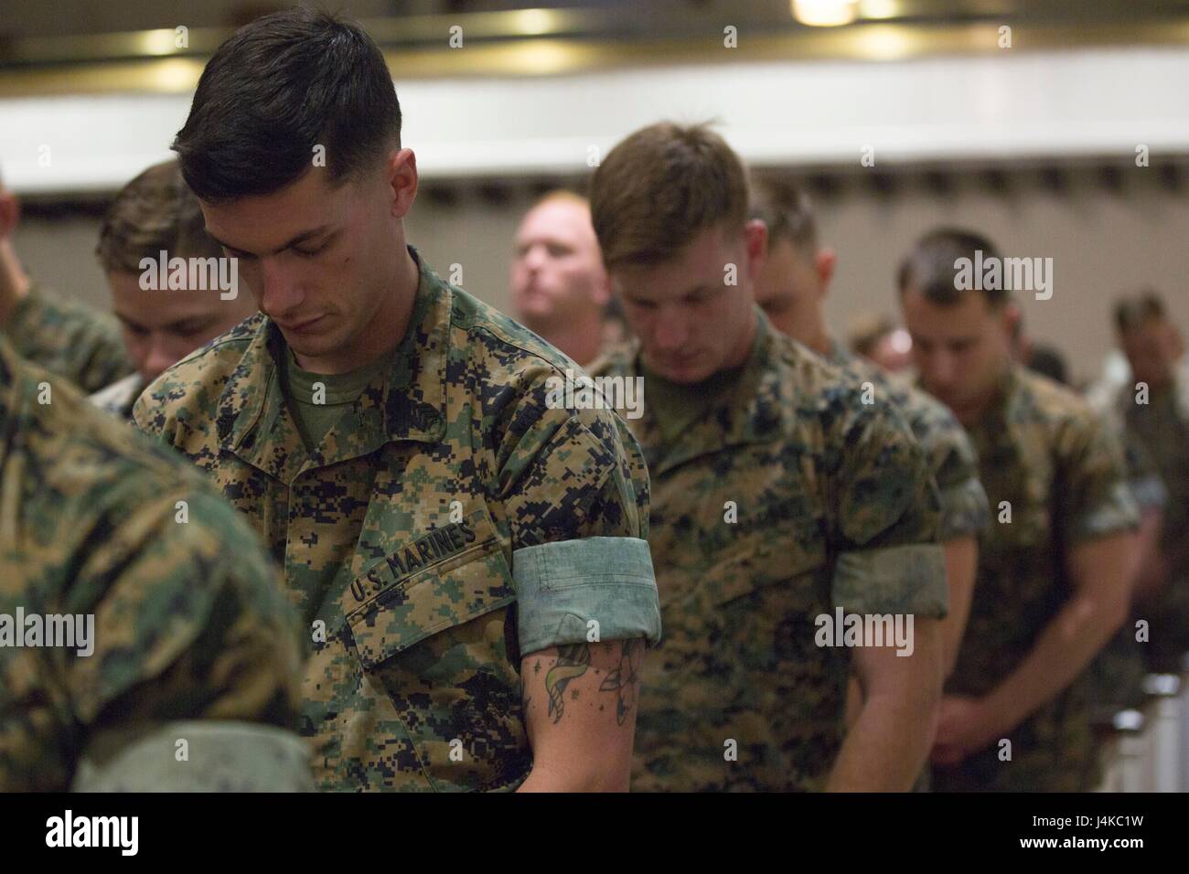 U.S. Marines bow their heads during the memorial service for 1st Lt ...