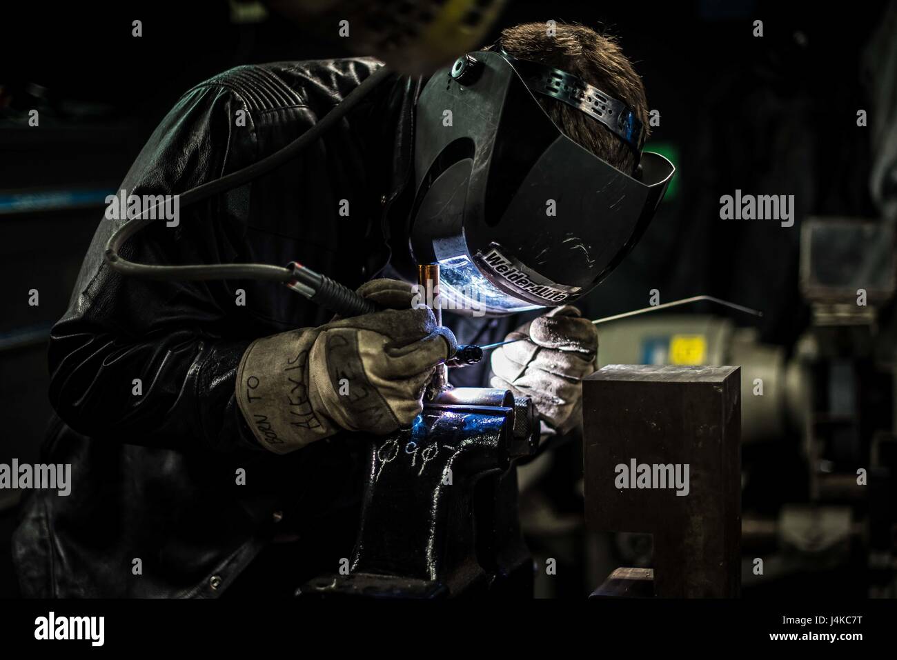 A Hull Maintenance Technician aboard aircraft carrier USS Theodore ...