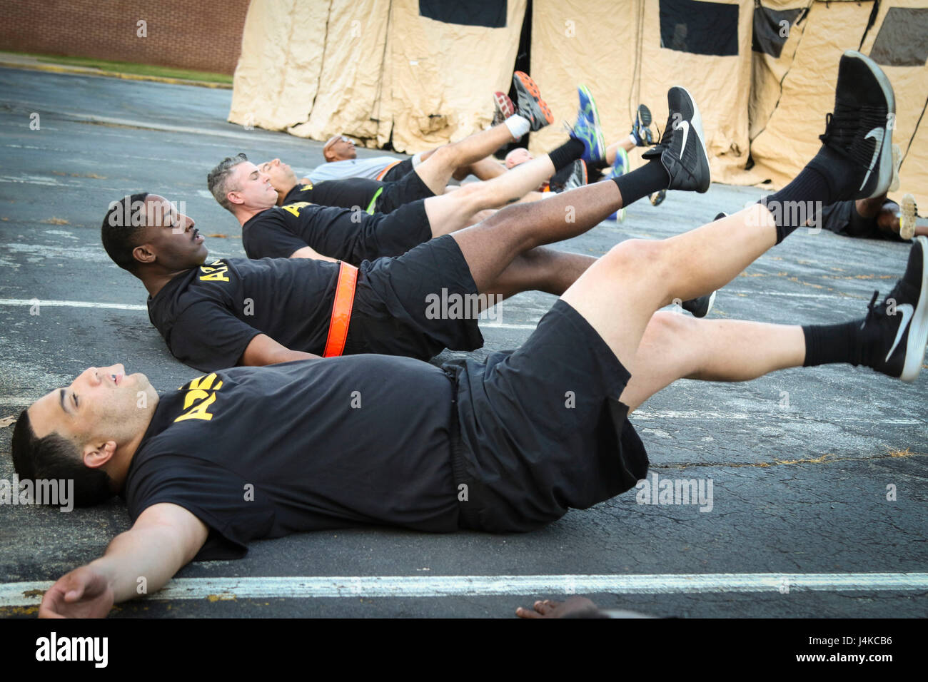 Soldiers from the 335th Signal Command (Theater), perform leg lift ...