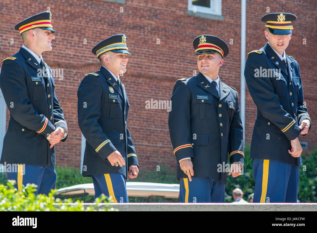 Brand new U.S. Army 2nd Lt. Allen Robertson (second from right) hobnobs ...