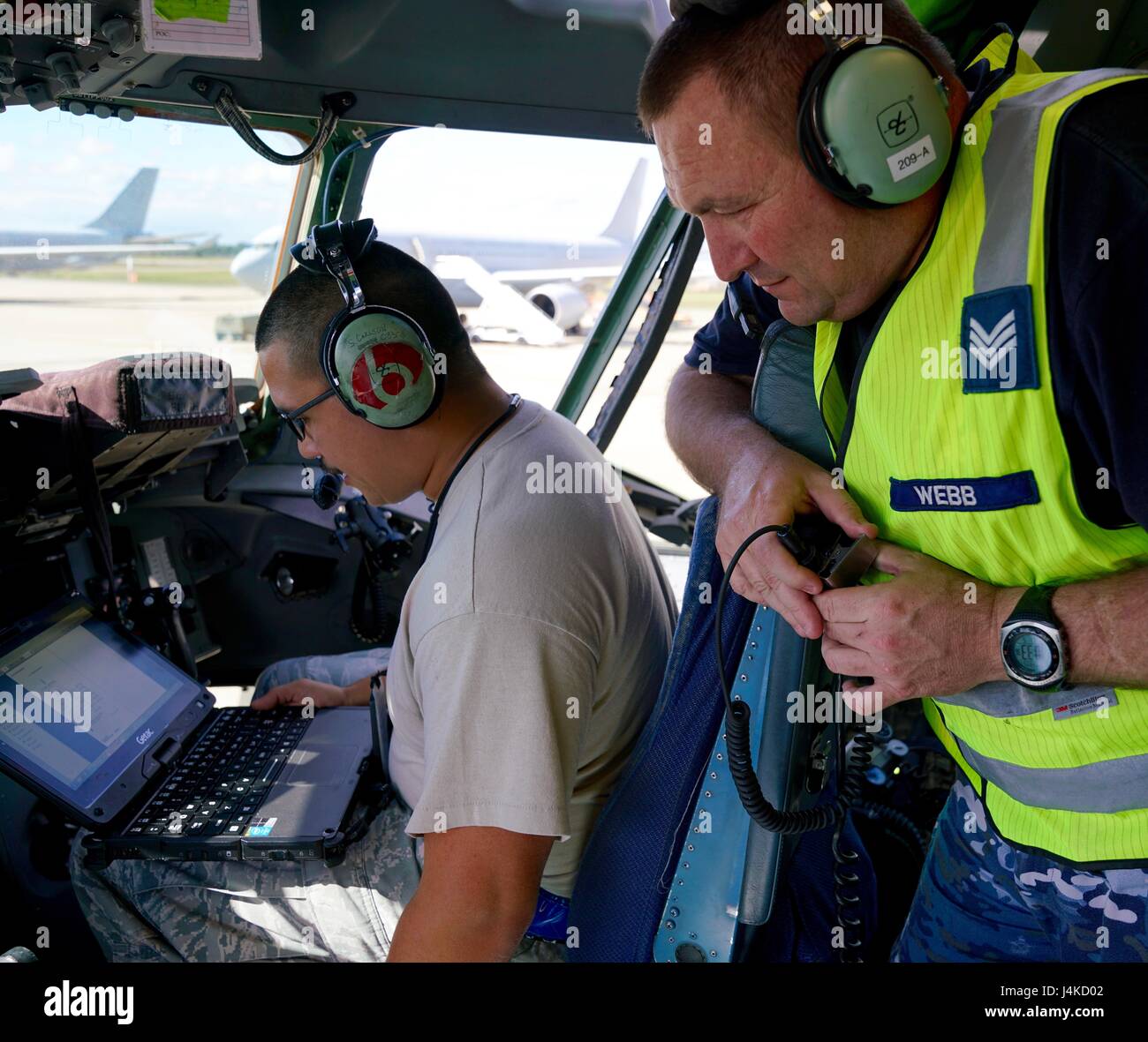 U.S. Air Force Staff Sgt. Jamie Santigo, left, performs an ops check ...