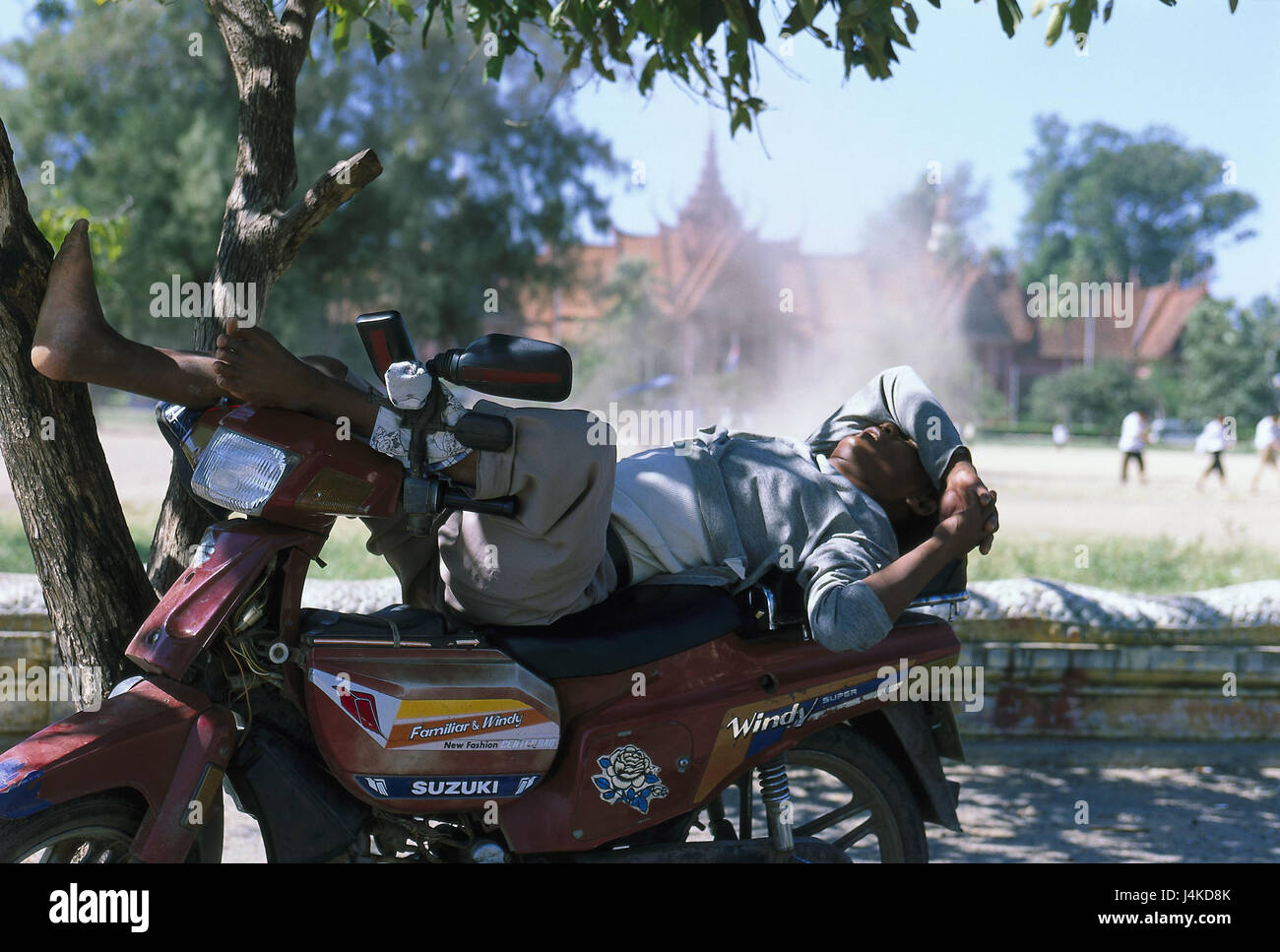 Cambodia, Phnom Penh, man, motorcycle, sleep no model release, South ...