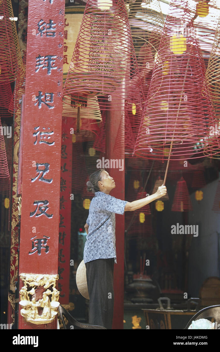 Vietnam, Mekong delta, Can Tho, pagoda, joss stick pyramid, woman ...